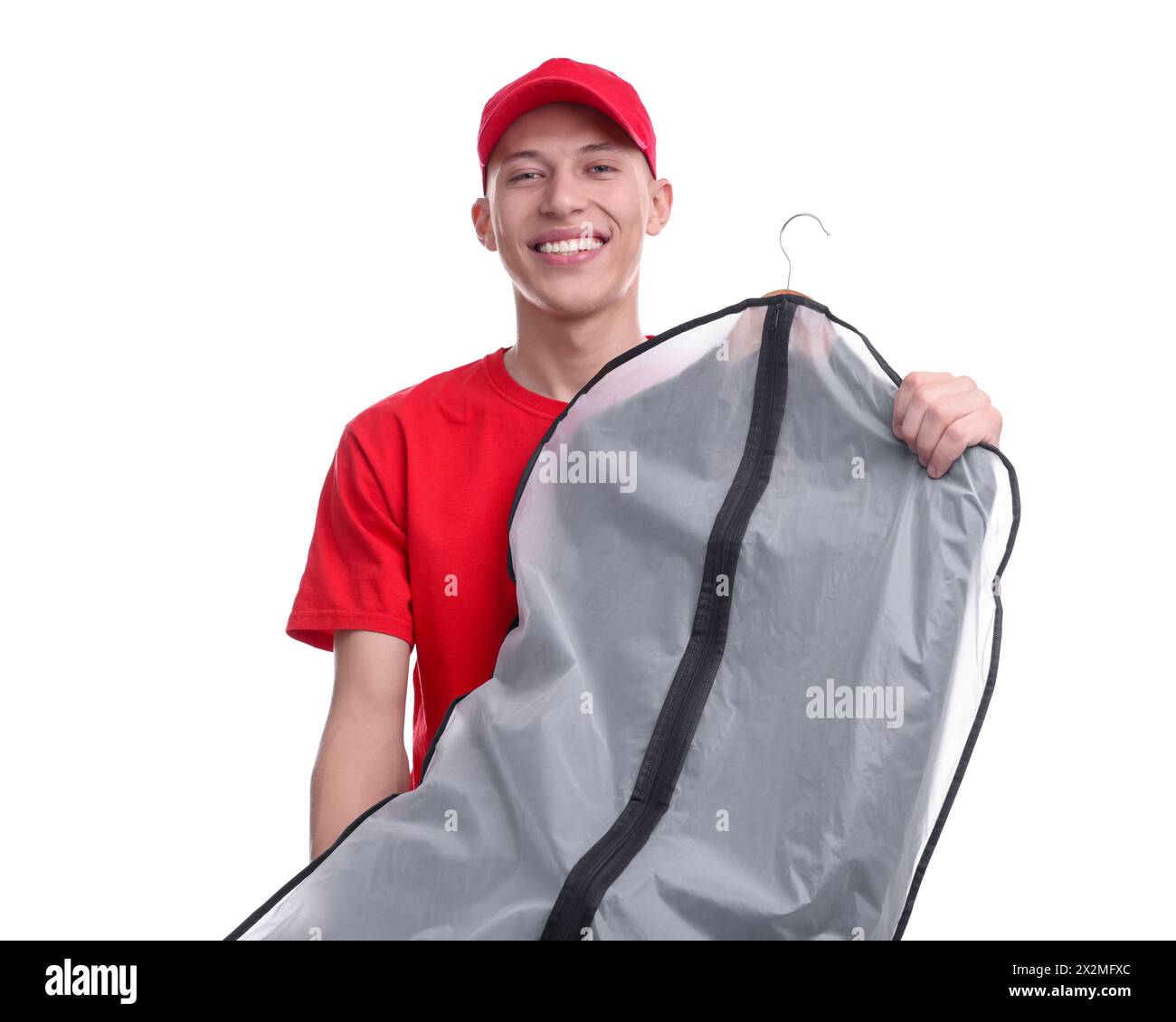 Dry-cleaning delivery. Happy courier holding garment cover with clothes ...