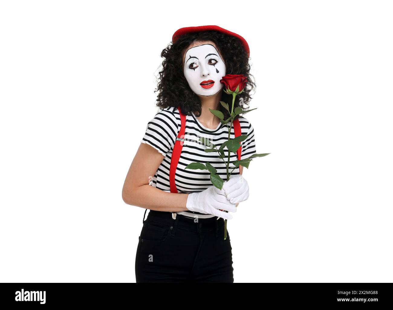 Funny mime with red rose posing on white background Stock Photo - Alamy