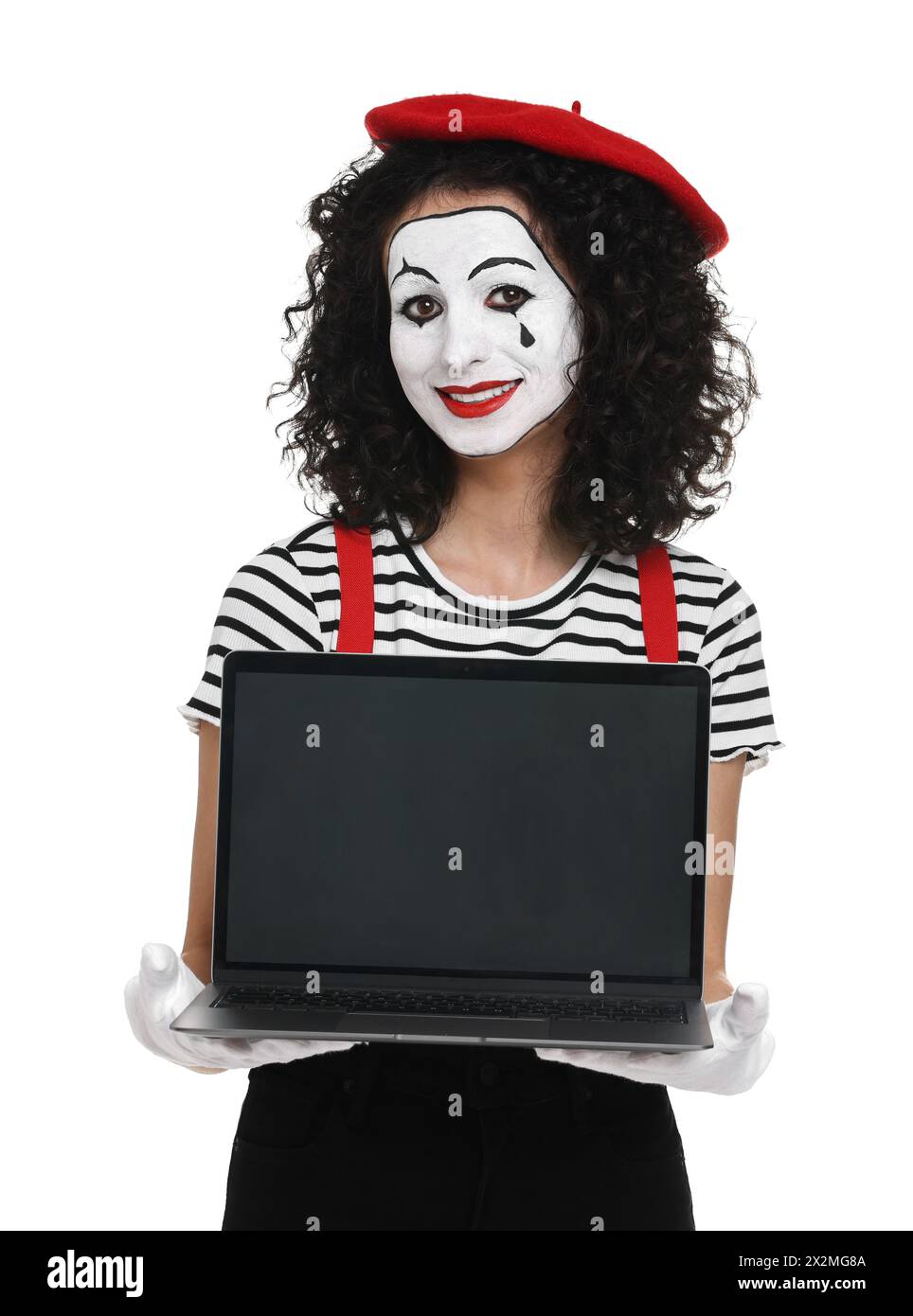 Funny mime with laptop posing on white background Stock Photo - Alamy