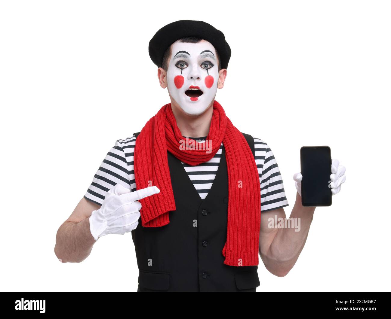 Funny mime artist pointing at smartphone on white background Stock ...