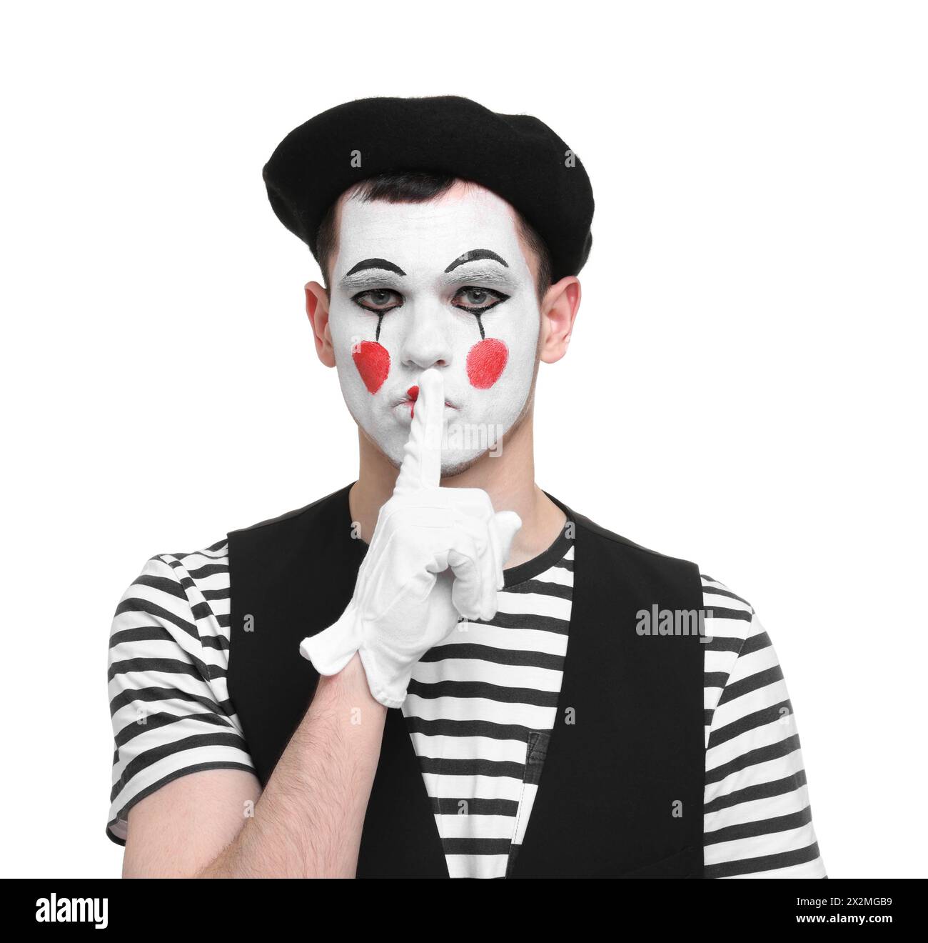 Mime artist in beret showing hush gesture on white background Stock ...
