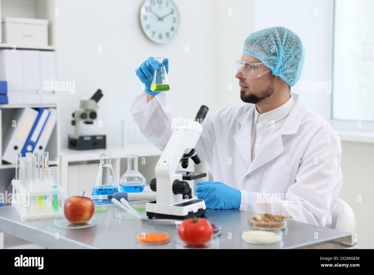 Quality control. Food inspector checking safety of products in ...