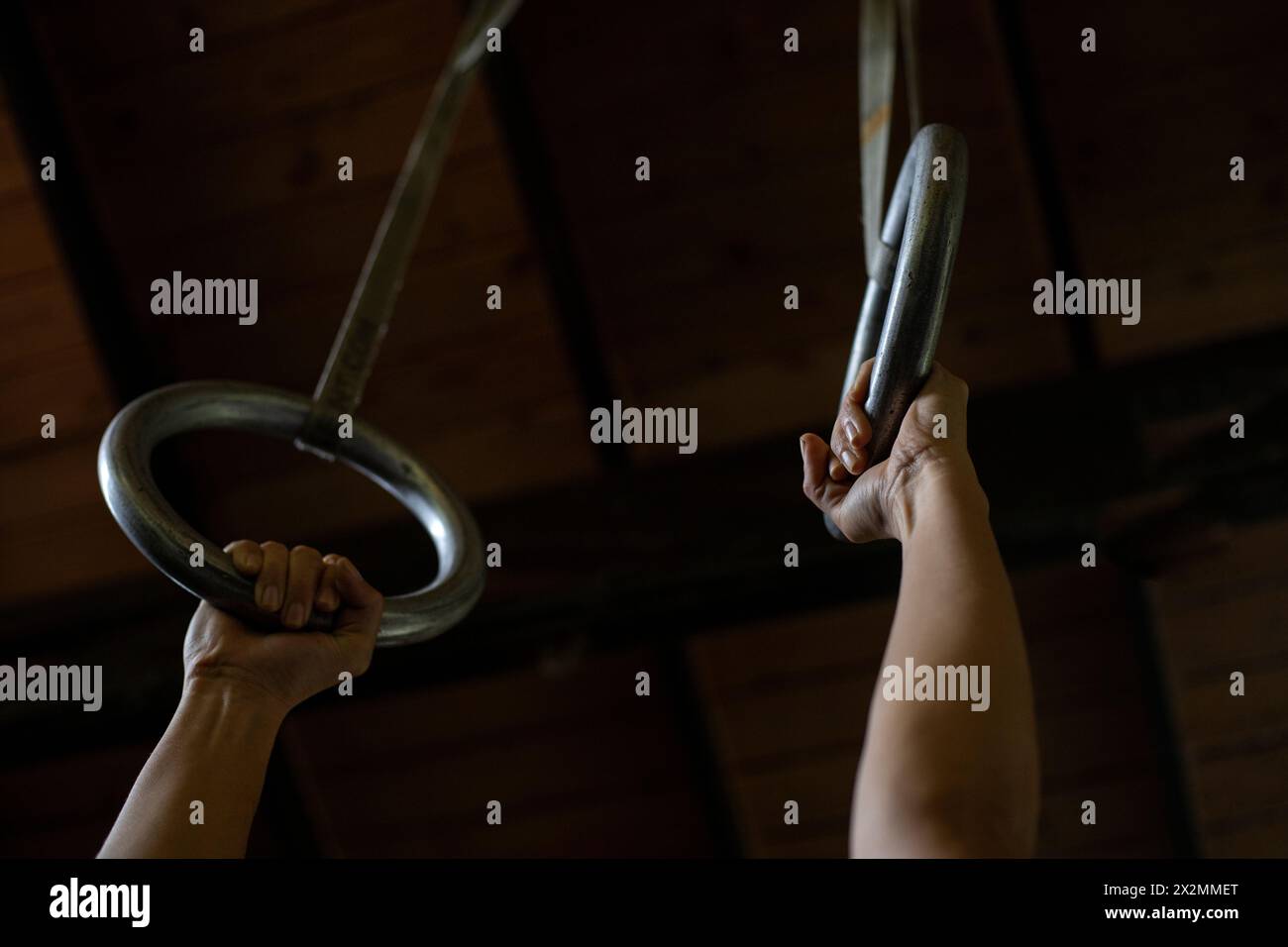 Latin American woman hands holding gymnastic rings during her workout ...