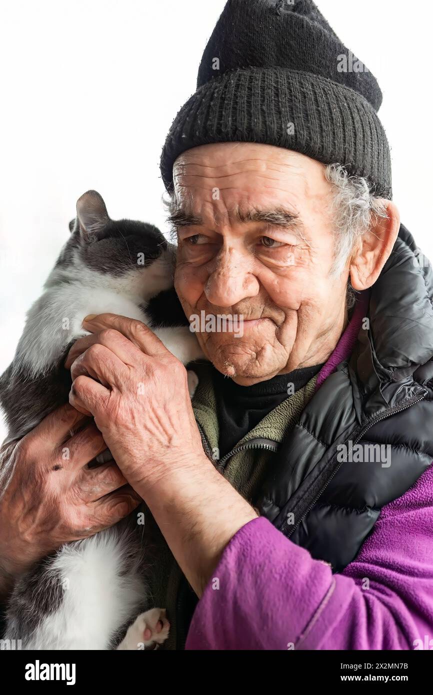 Old Russian man holding his cat and smiling Stock Photo - Alamy