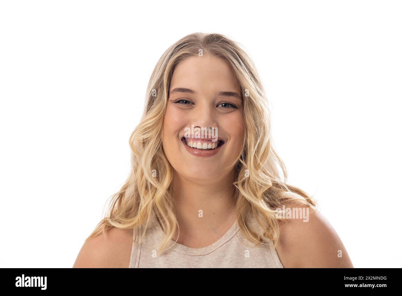 Caucasian young female plus size model smiles on white background, copy ...