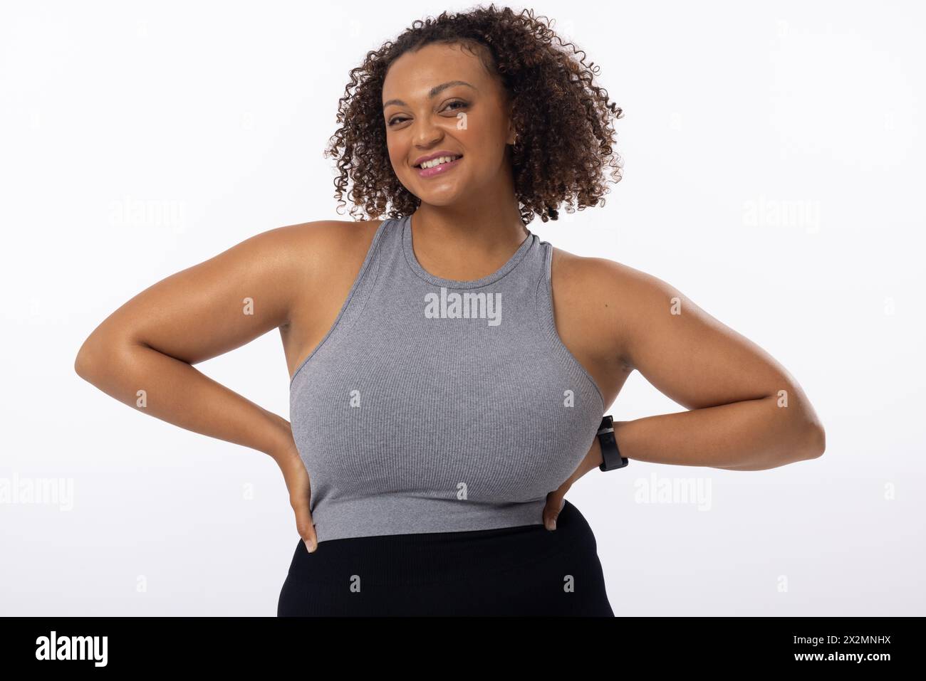 A biracial young female plus size model poses on white background Stock ...