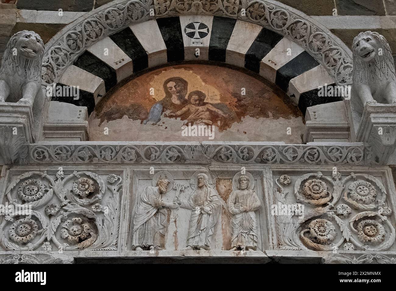 Sculpted tympanum and lintel on central portal in the façade of the ...