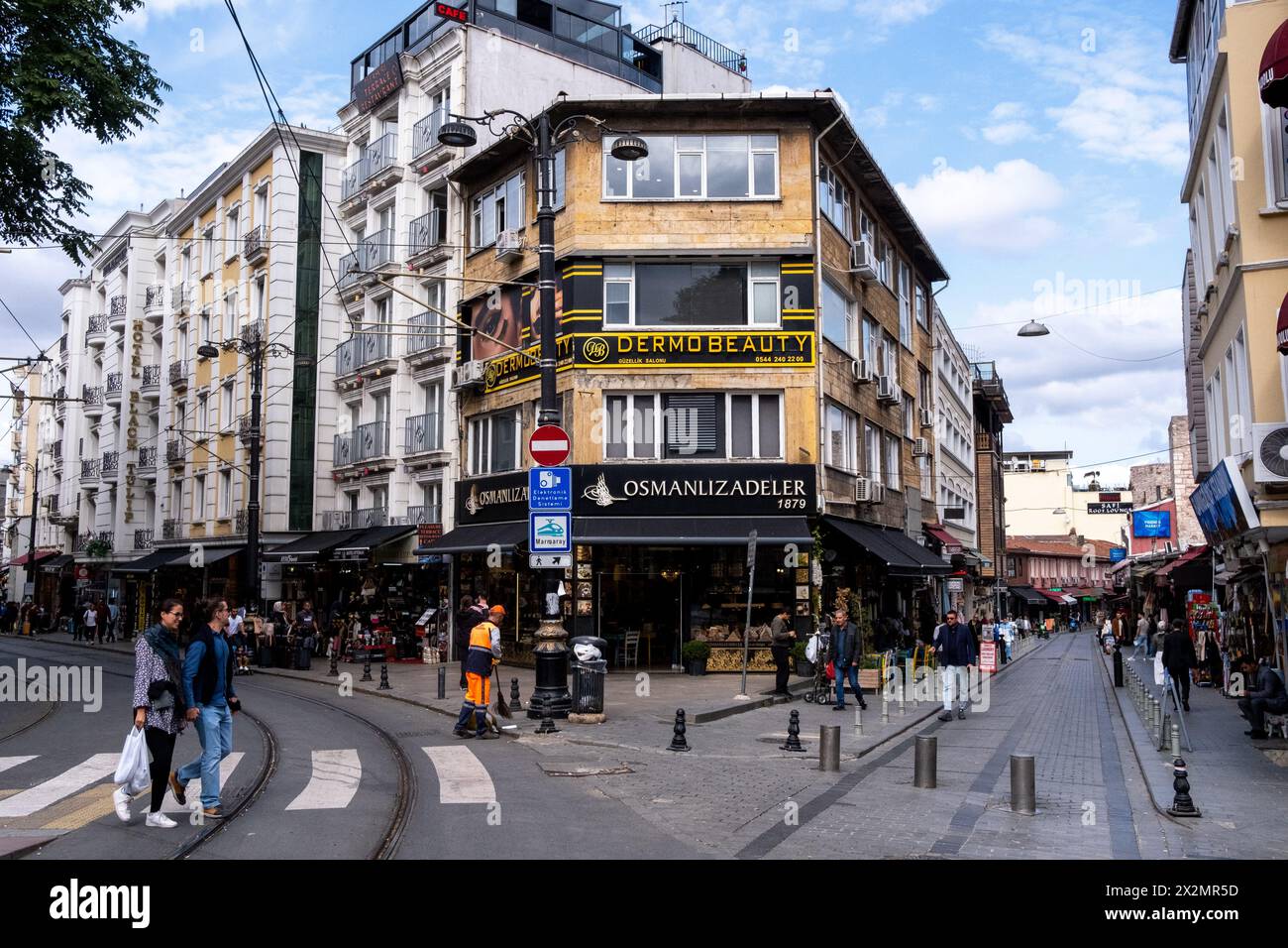 Street scene with passers-by, shops and apartment blocks in Istanbul ...