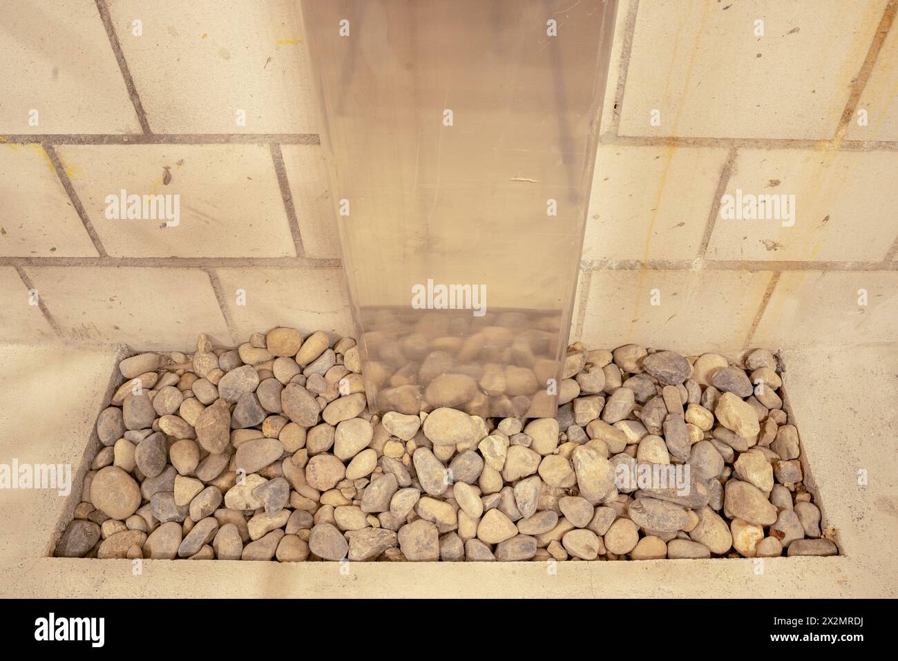 Reflecting and shiny metal sheet in basement, going from the ceiling to ...