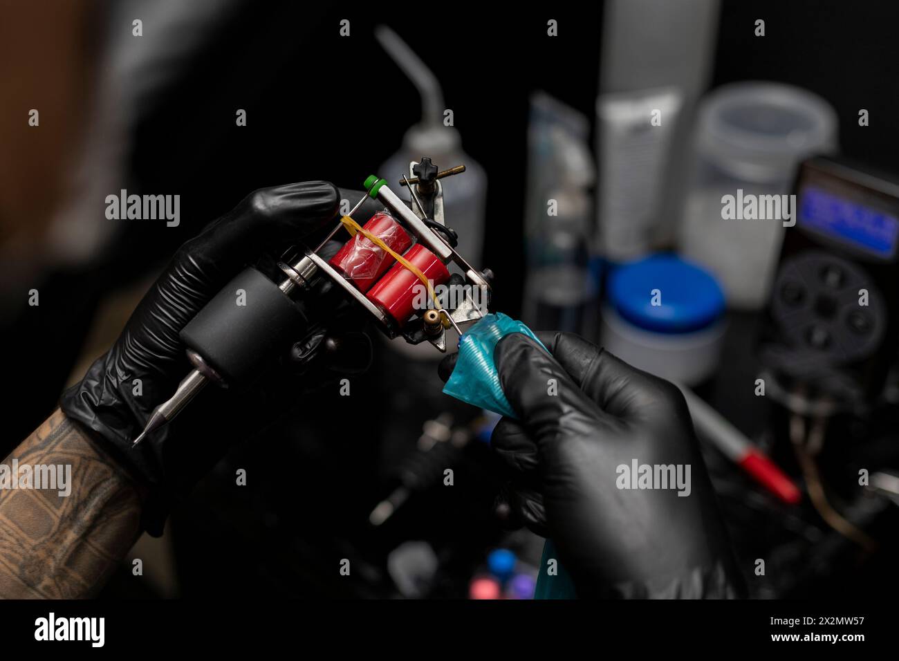 Professional tattoo artist wearing black hi-res stock photography and ...