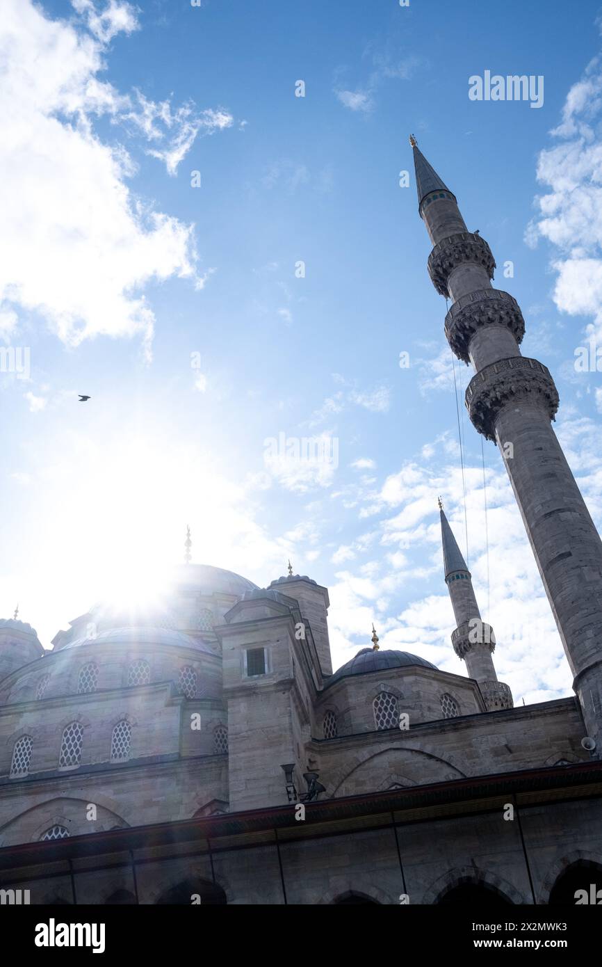 Backlit view of the New Mosque (Yeni Cami or Valide Sultan Camii), an ...
