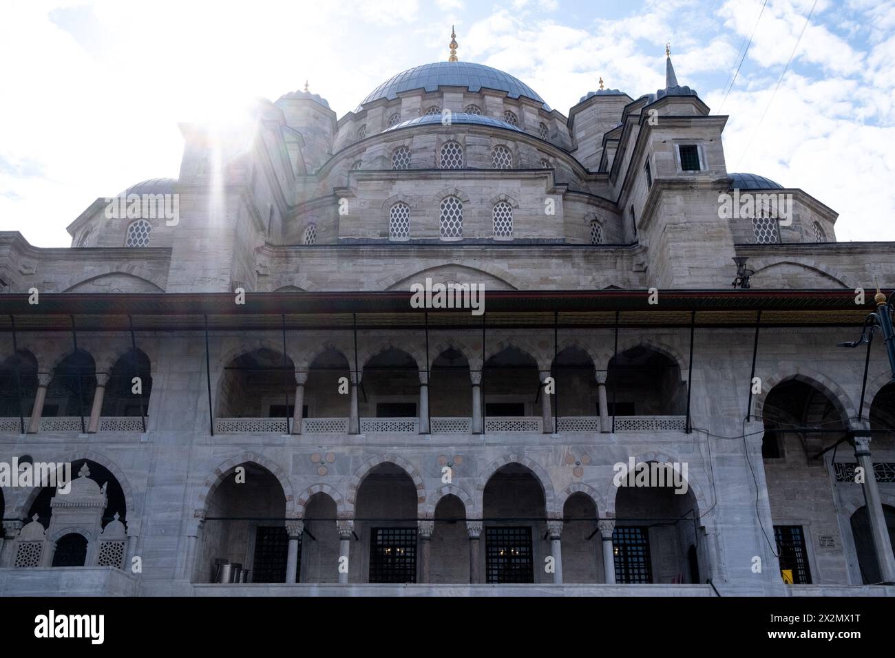 Backlit view of the New Mosque (Yeni Cami or Valide Sultan Camii), an ...