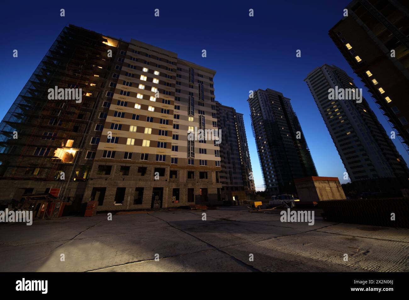 Construction of high building in night Stock Photo - Alamy
