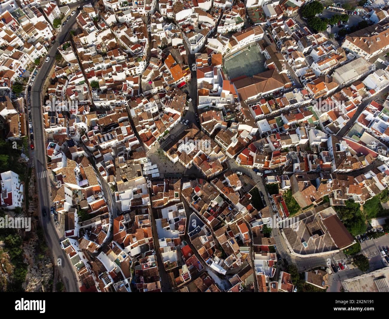 Overhead view of the curved streets and rooftops in Ojen, revealing the ...