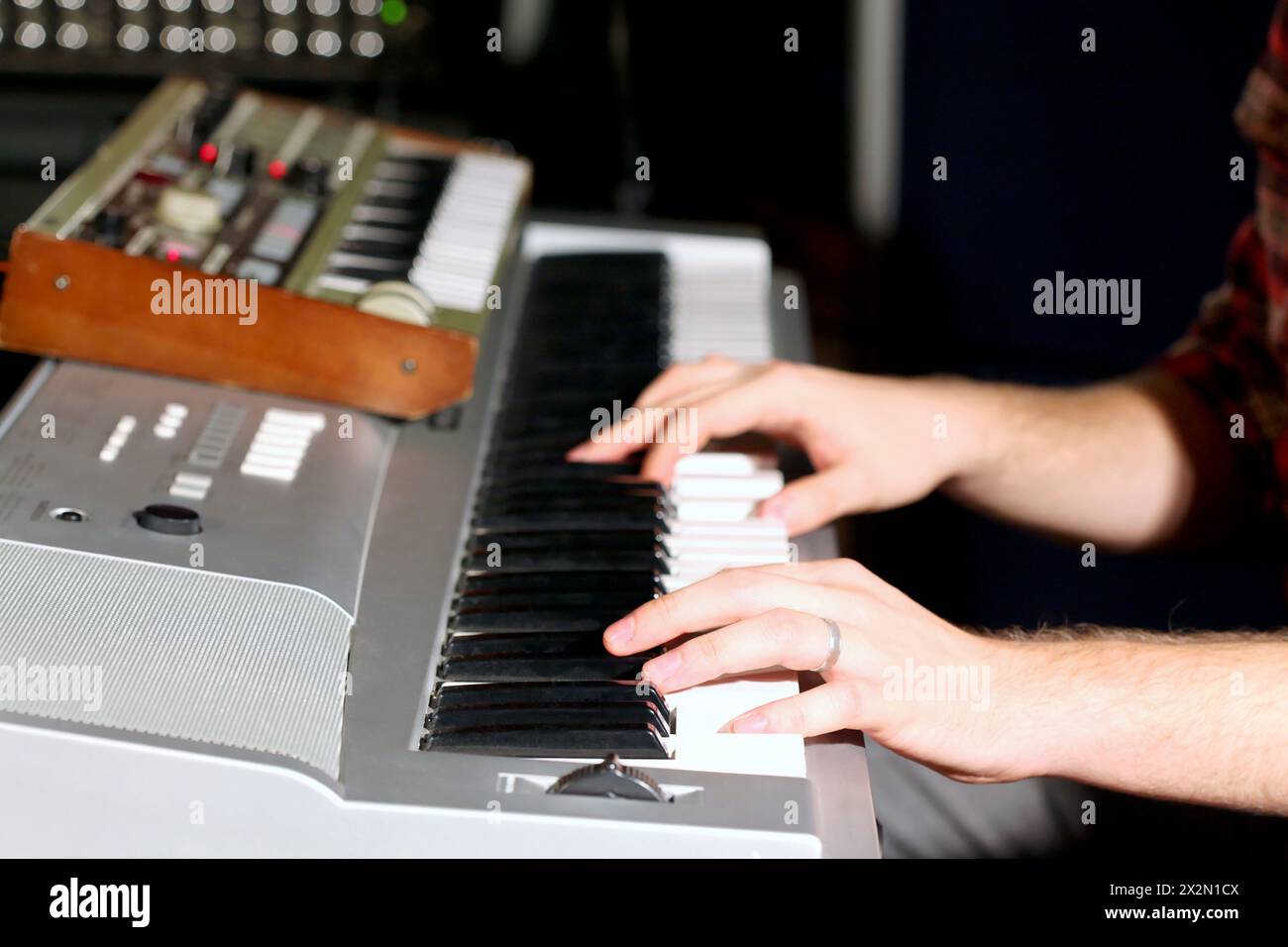 Musician hands on keyboard of electric organ Stock Photo - Alamy