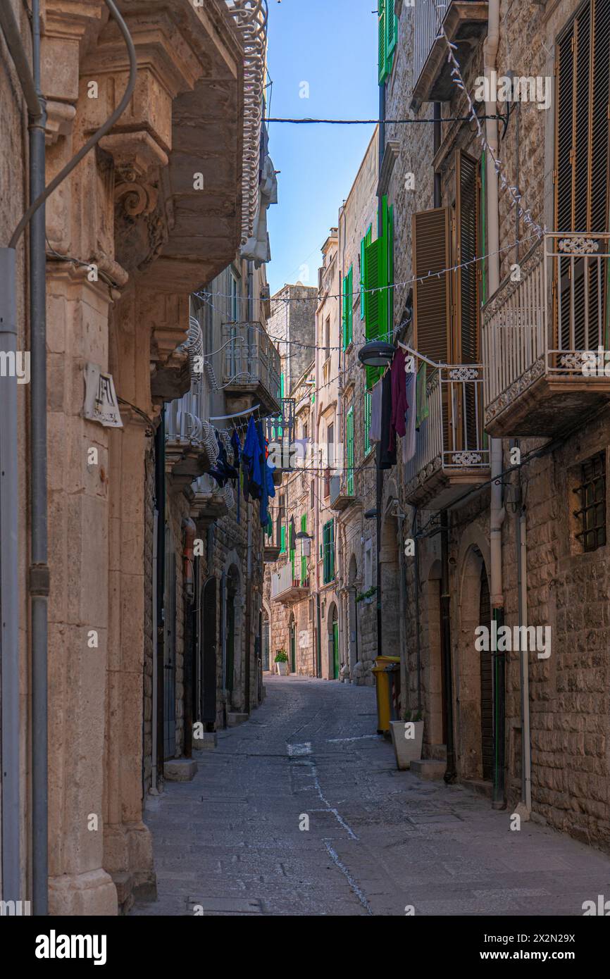 Molfetta old town. Small cobblestone street and stone residential ...
