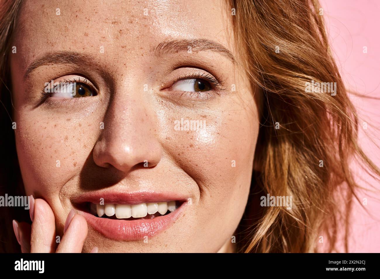 A detailed view of a womans face displaying her natural freckles ...