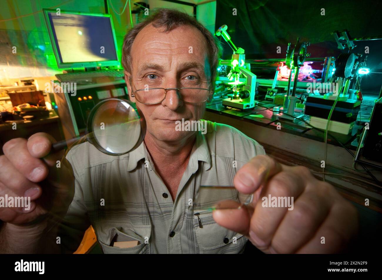 Scientist with glass, loupe pose in his lab of movement of ...