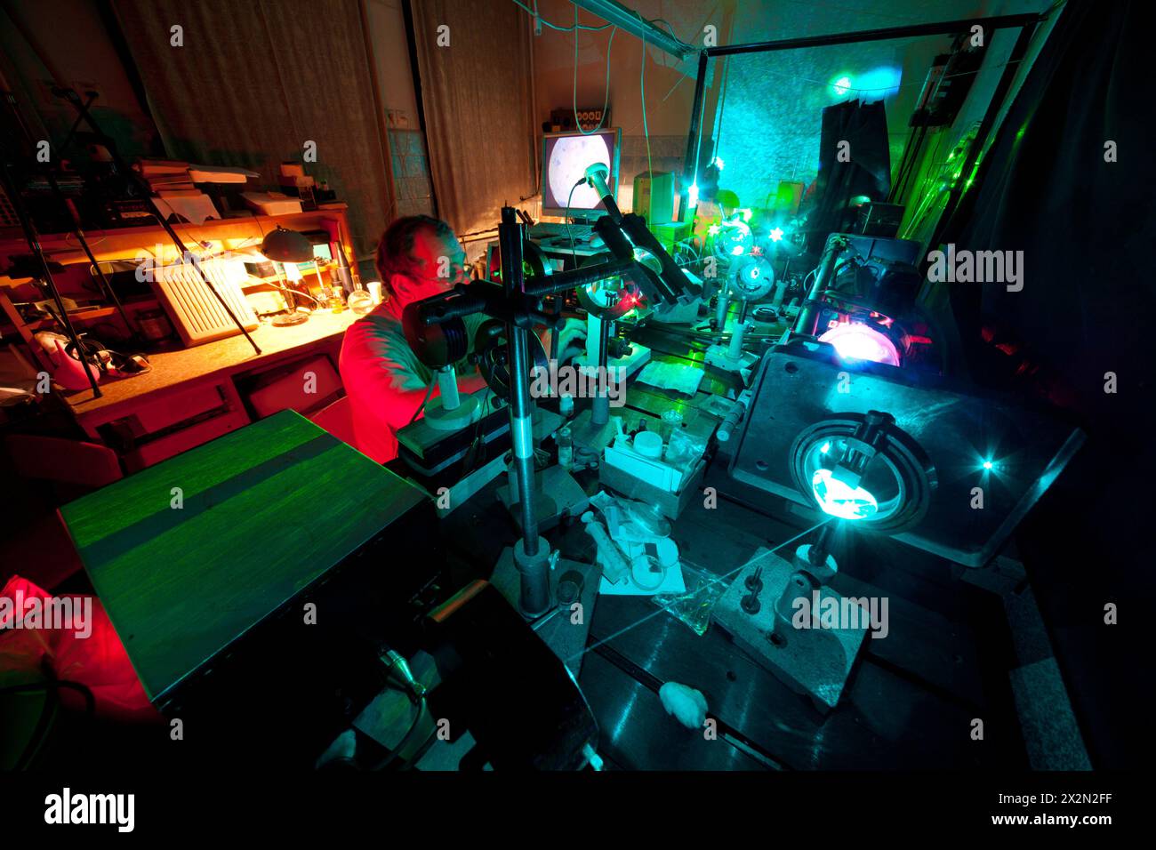 Scientist engaged in research in his lab about movement of ...