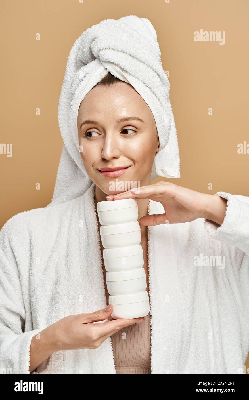A natural beauty in a white robe, holding cream with grace and elegance ...