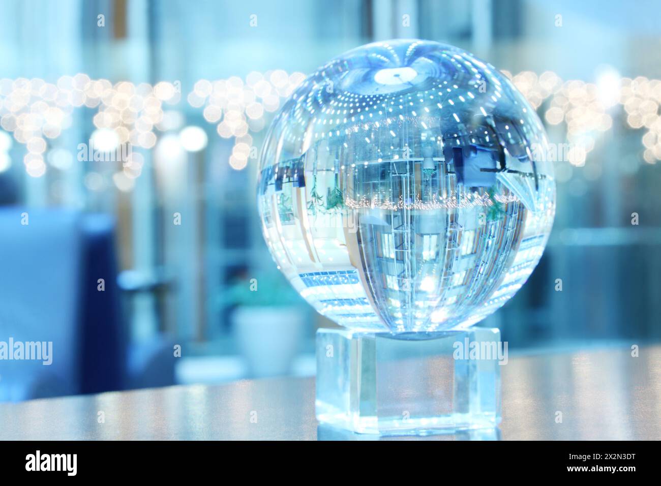 Glass sphere on support with reflection of skyscraper in it Stock Photo ...