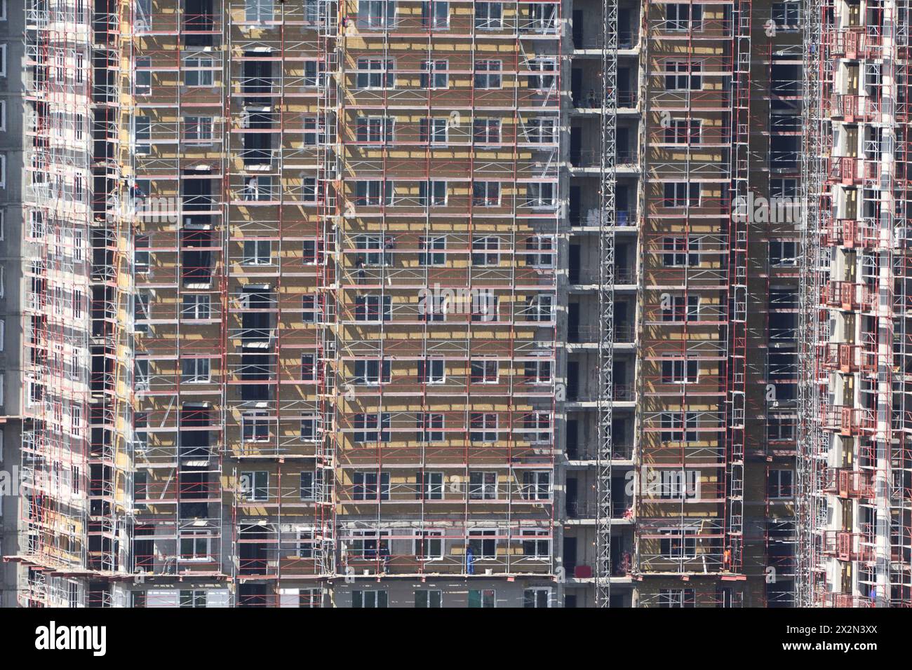 Construction of new building with workers Stock Photo - Alamy