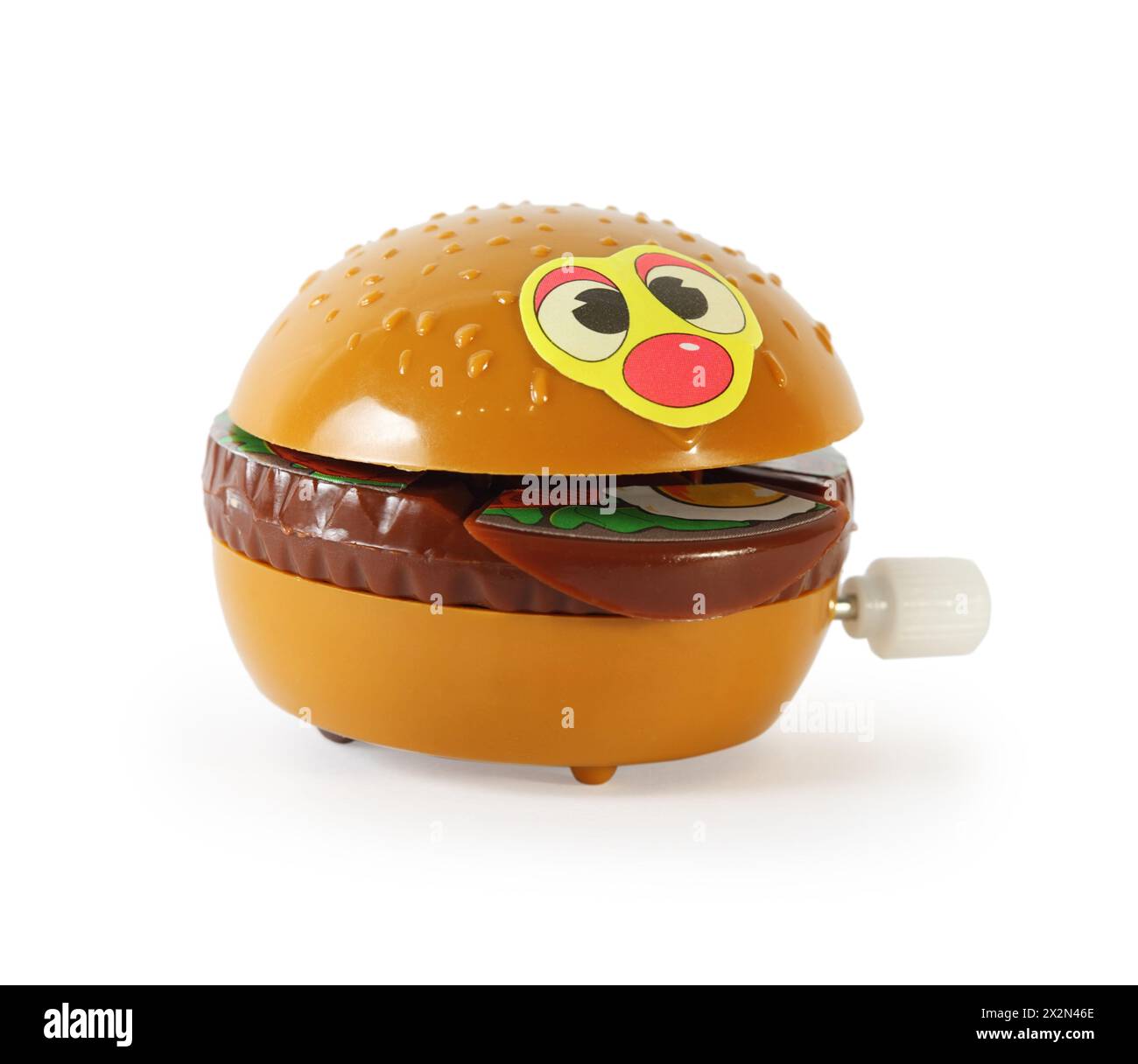 Plastic toy mechanical hamburger isolated on white background Stock ...