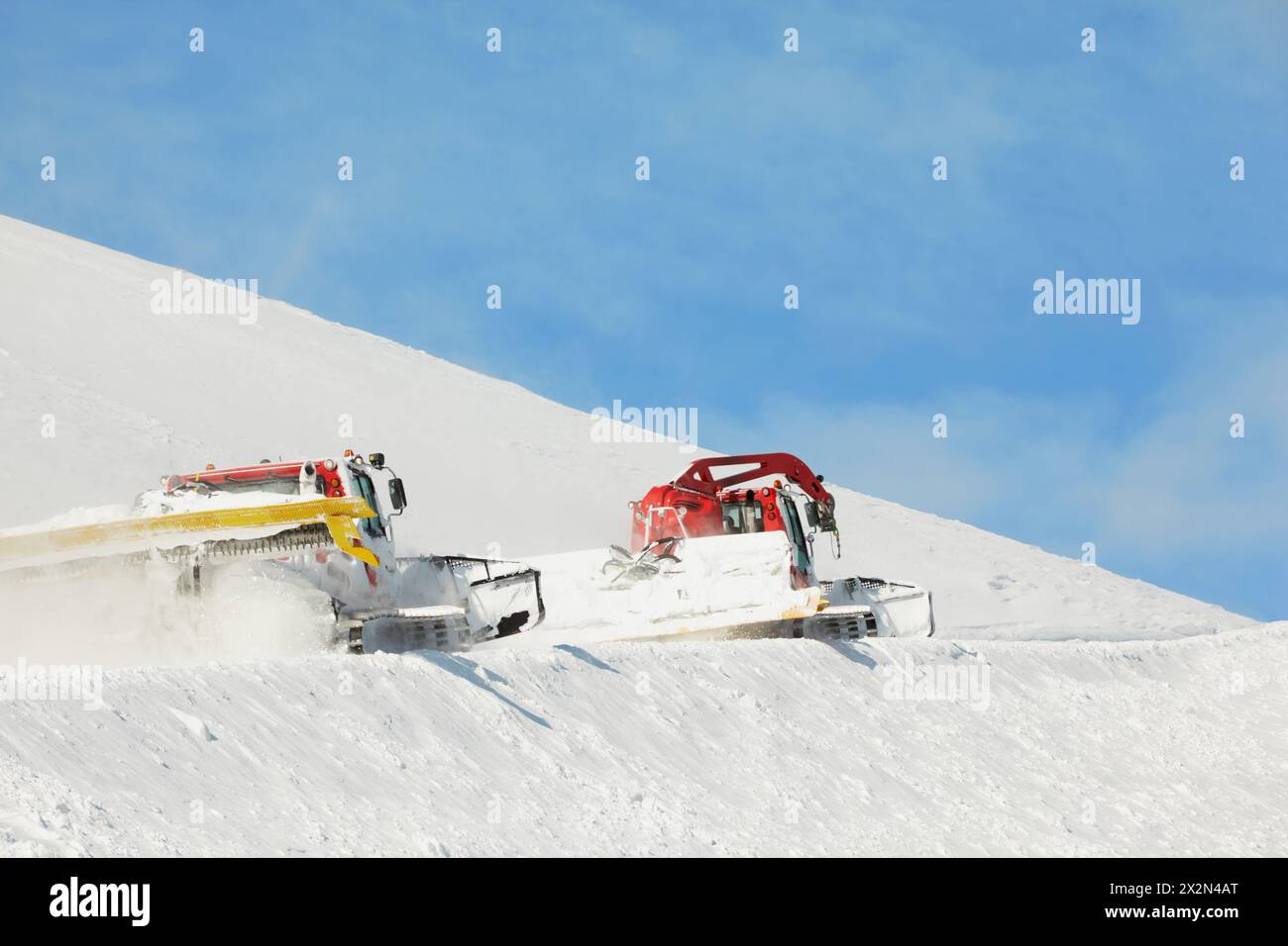 Machines for skiing slope work Stock Photo - Alamy