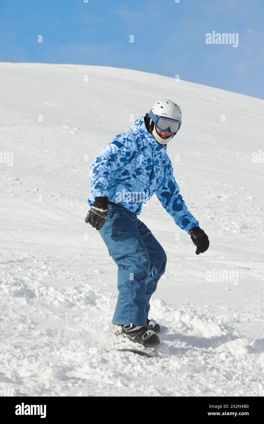 Skier slides down snowy slope hi-res stock photography and images - Alamy