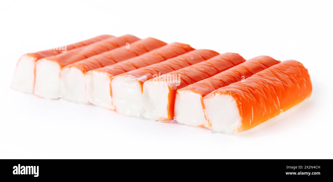 Row of eight bright red crab sticks isolated on white background Stock ...