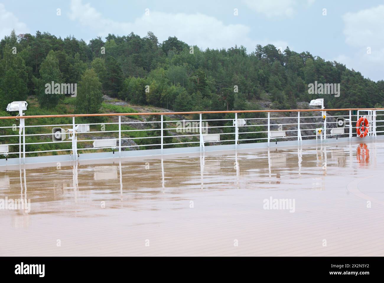 Wet deck of large passenger ship with view on forest Stock Photo - Alamy