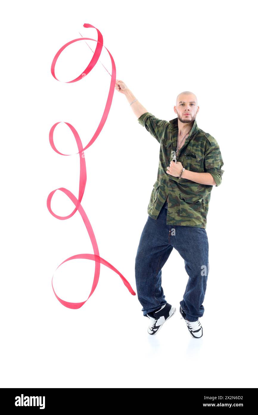 Rapper in camouflage jacket with ribbon stands on tiptoes isolated on ...