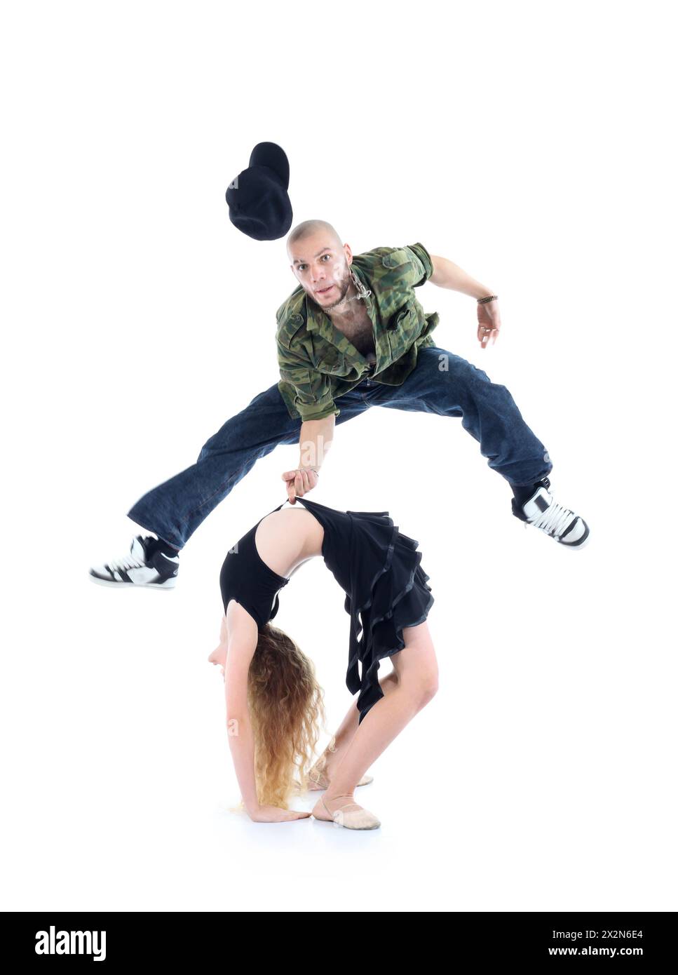 Gymnast does bridge and rapper jump above her and tries to lift her ...