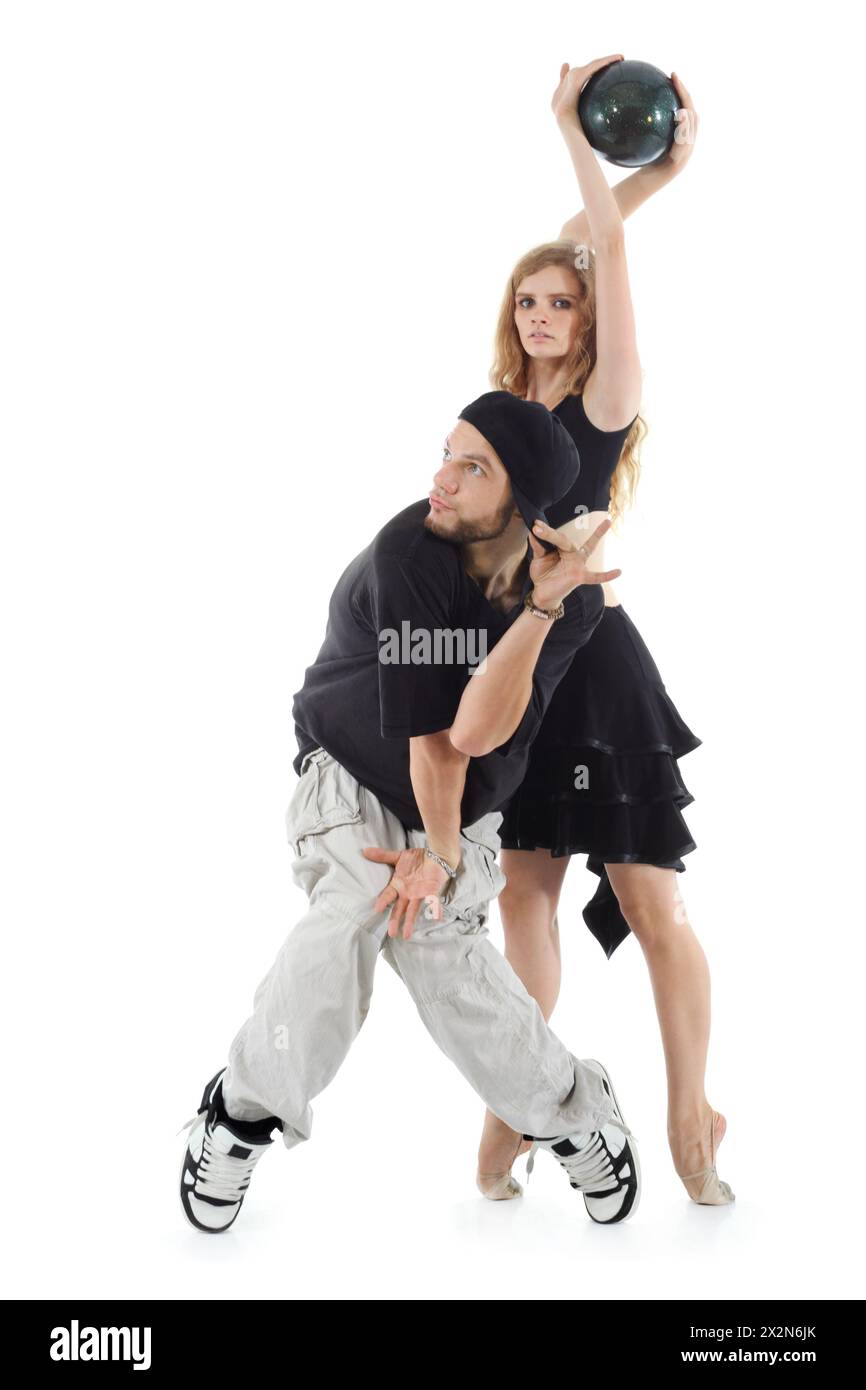 Rapper stands on tiptoe, keeps hand to visor and hamming and gymnast ...