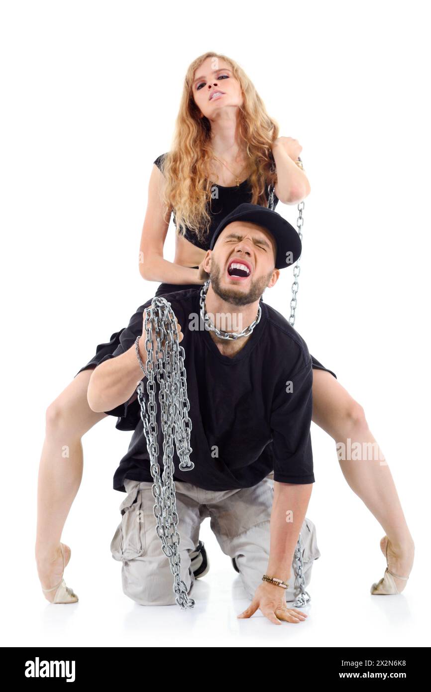 Graceful girl in black sits on papper back and tames his chain isolated ...