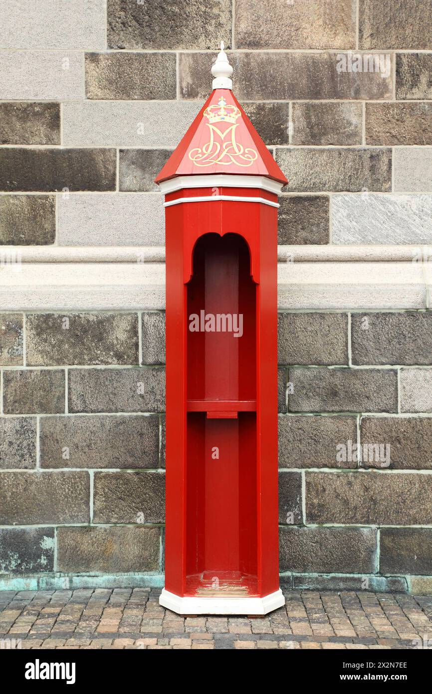 Old red shed with golden monogram at street in Copenhagen, Denmark ...