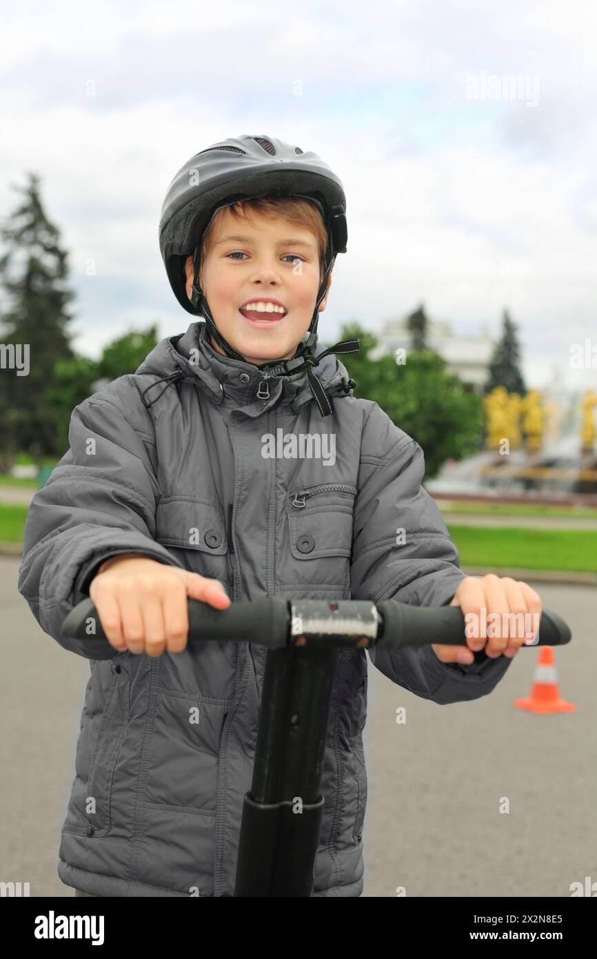 Little boy ride on segway near friendship fountain, cone in Moscow ...