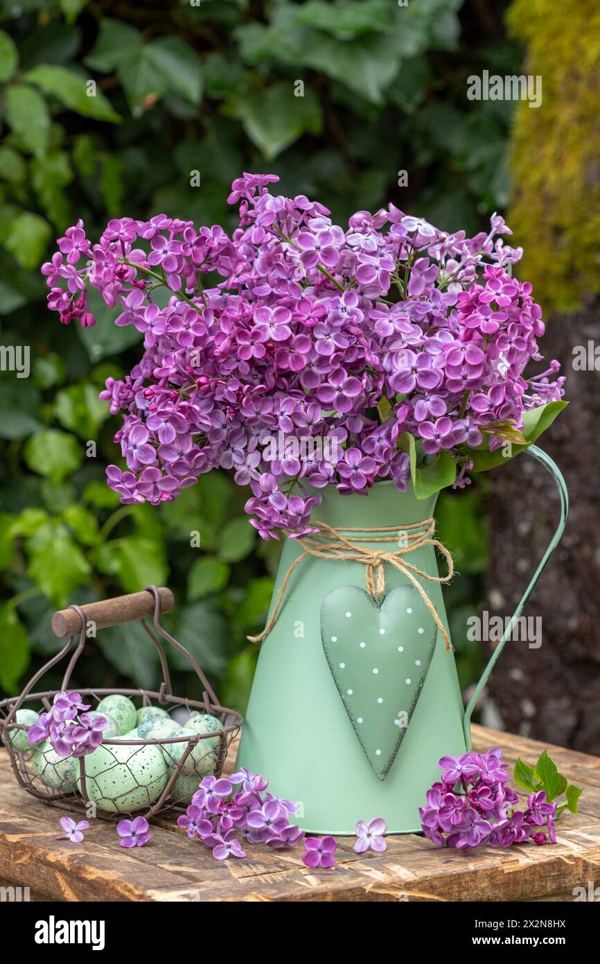 easter arrangement with bouquet of lilac and easter eggs Stock Photo ...