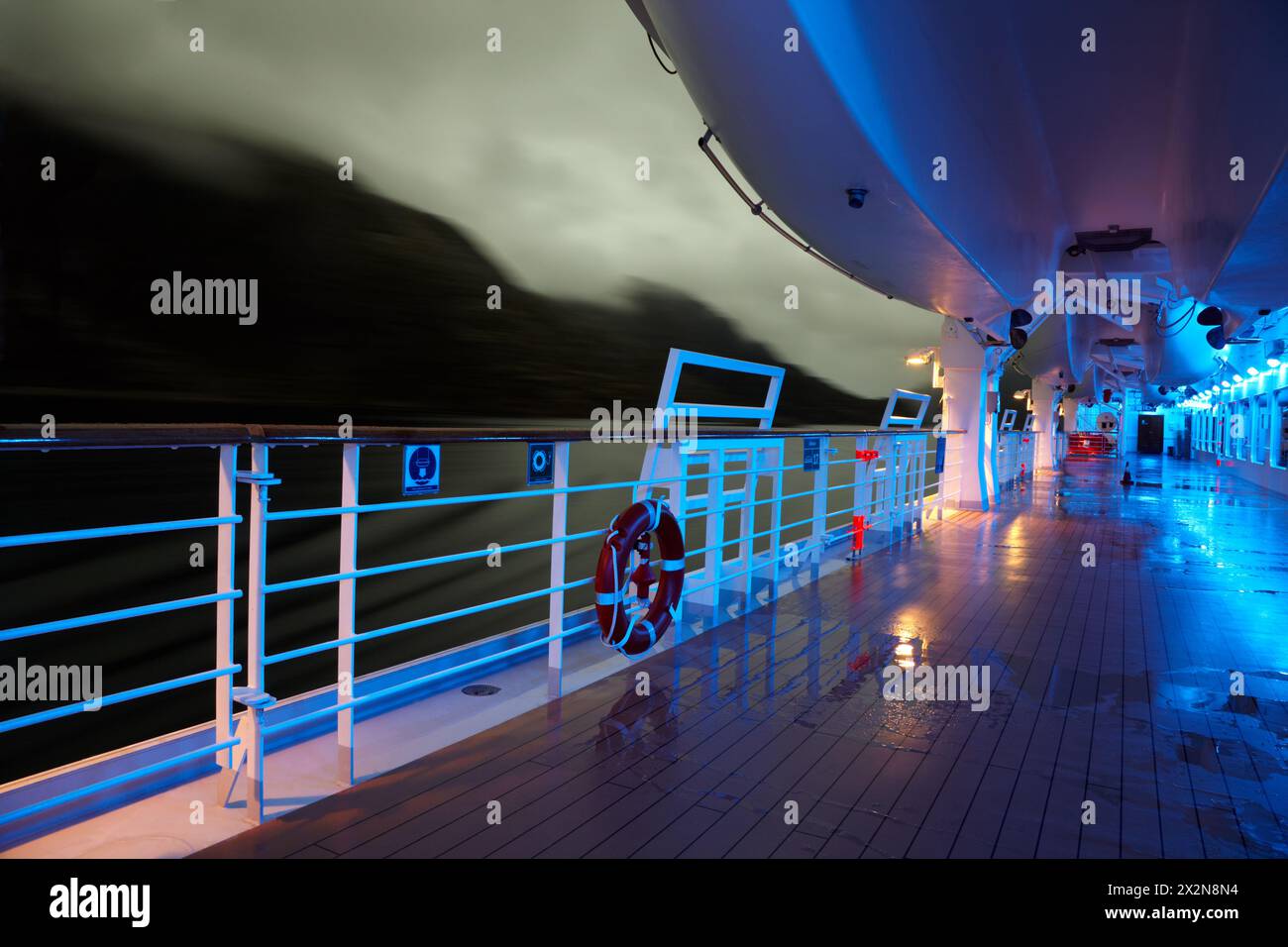 Deck with lifeboats in evening light Stock Photo - Alamy