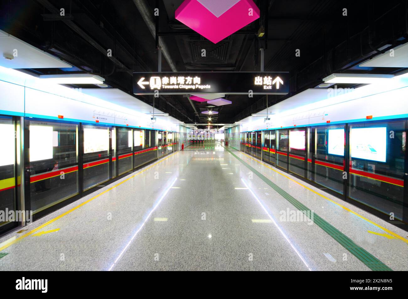 Enters to metro in the subway of South train station in Guangzhou ...