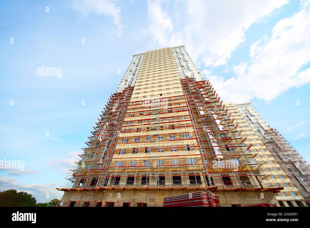 MOSCOW - SEP 27: Tubes, tree near construction of high building on Sep ...