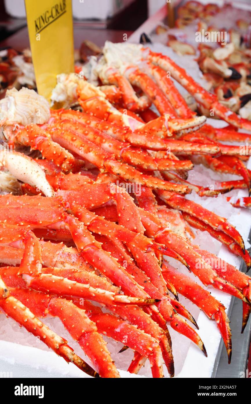 Fresh red king-crab legs in ice at seafood market; cabs high content ...
