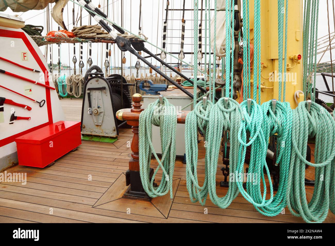 Many ropes, windlass and rigging on an ship with wooden deck Stock ...
