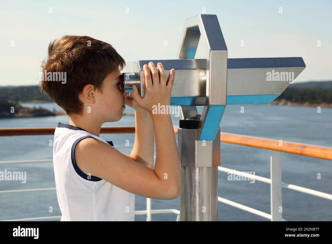 Boy looks sea through binocular hi-res stock photography and images - Alamy