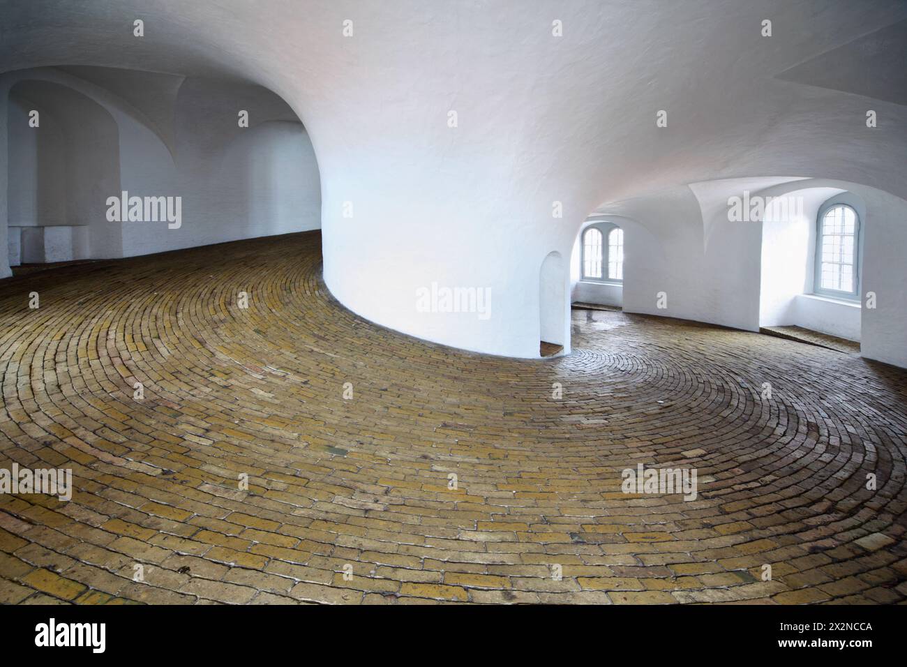 Screw rise in Rundetarn Tower in Copenhagen, Denmark. Brick floor and ...