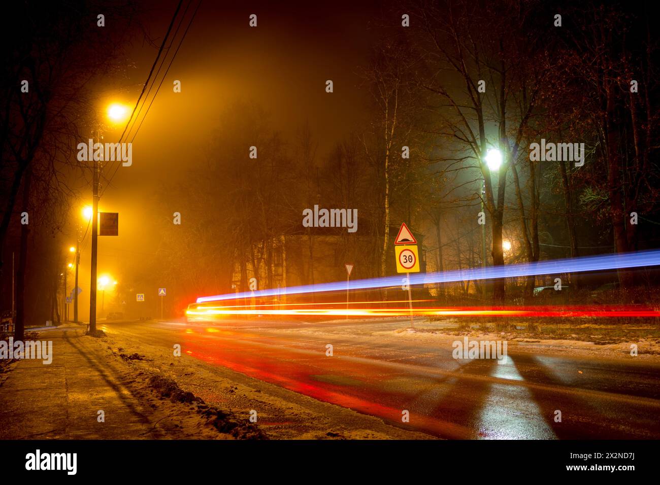 A sleeping area with scattered light during a night fog Stock Photo - Alamy