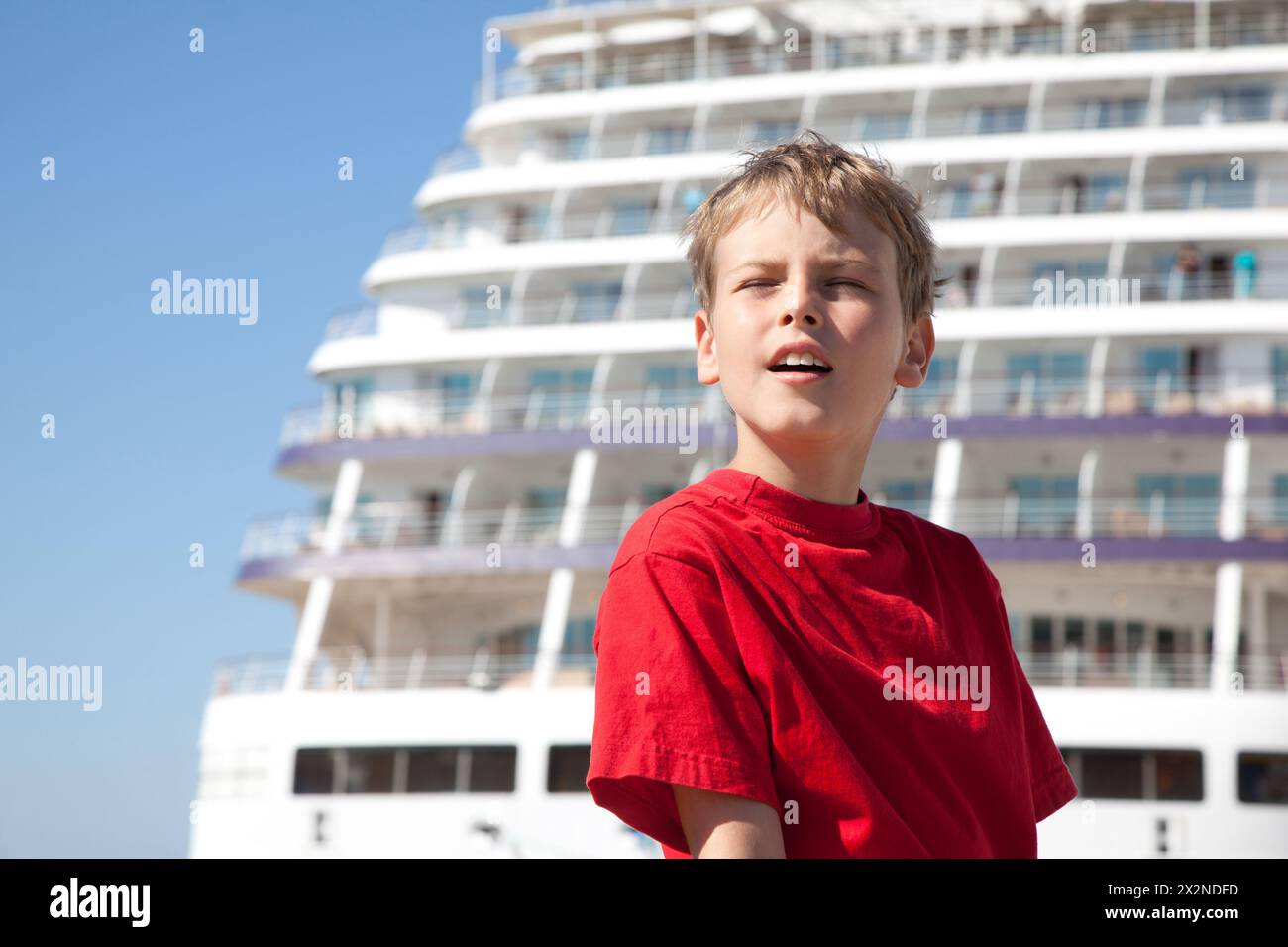 little boy closed eyes against background ship Stock Photo - Alamy