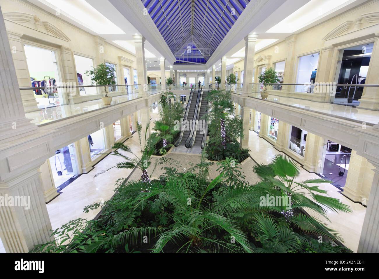 MOSCOW - DECEMBER 15: Hall with escalator and palms in Crocus City Mall ...