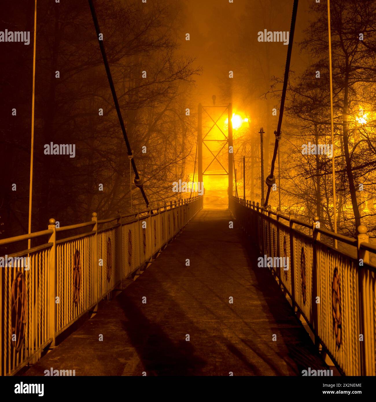 Pedestrian bridge in dense fog at night, foggy evening Stock Photo - Alamy