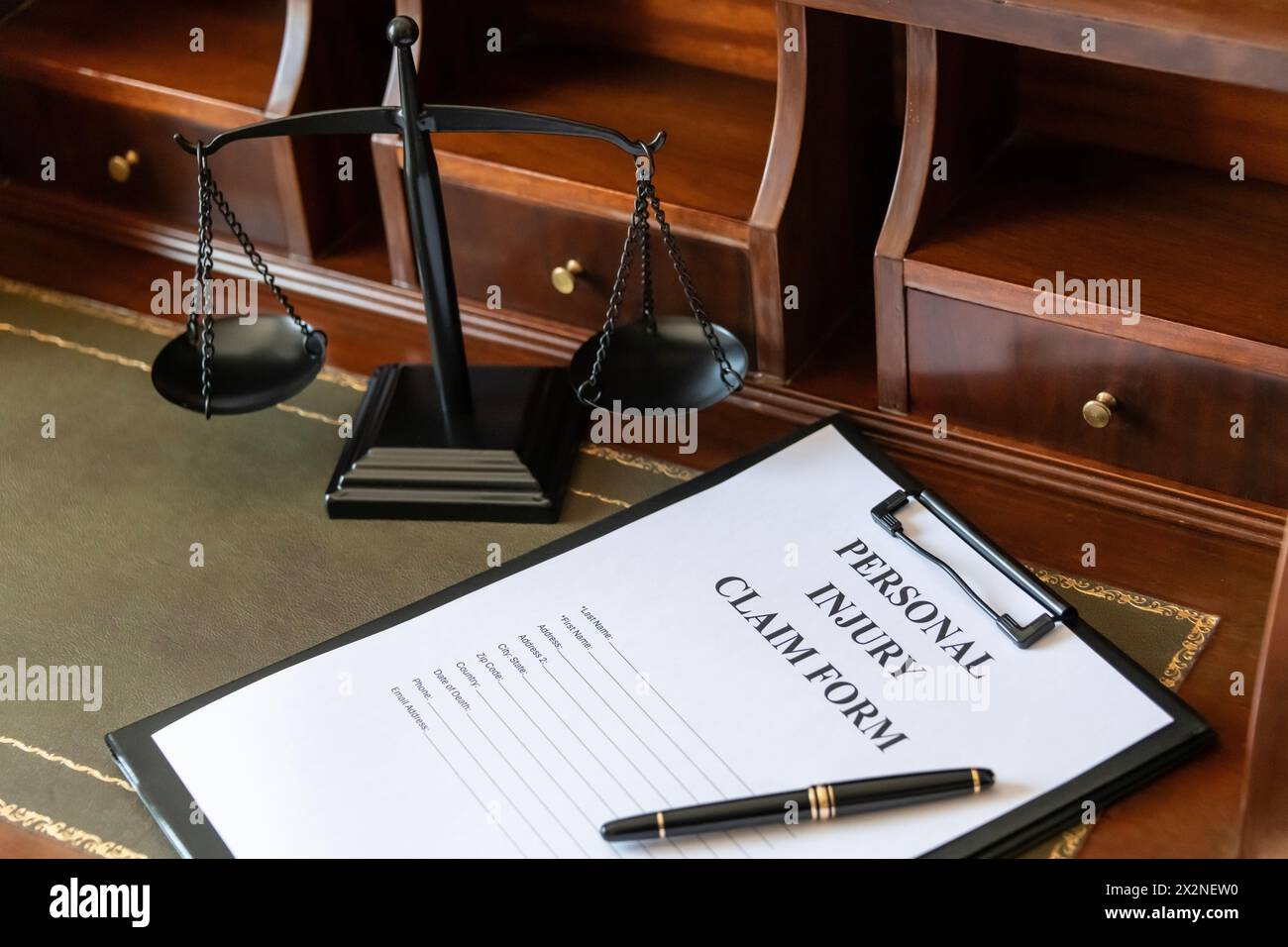 Legal Personal Injury Claim Form with Scales of Justice Stock Photo - Alamy